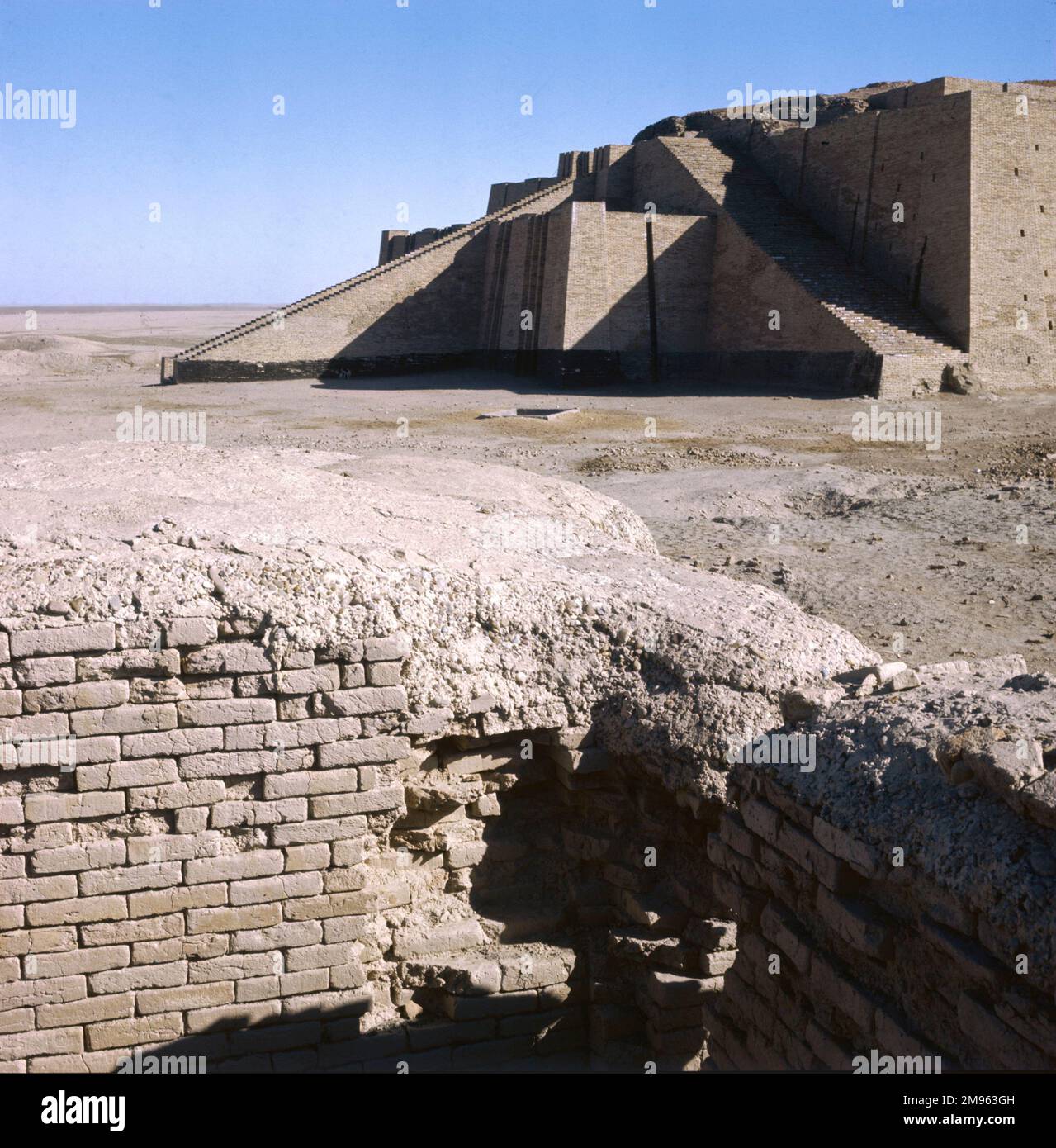 Excavated residential housewalls and part of the reconstructed Ziggurat ...