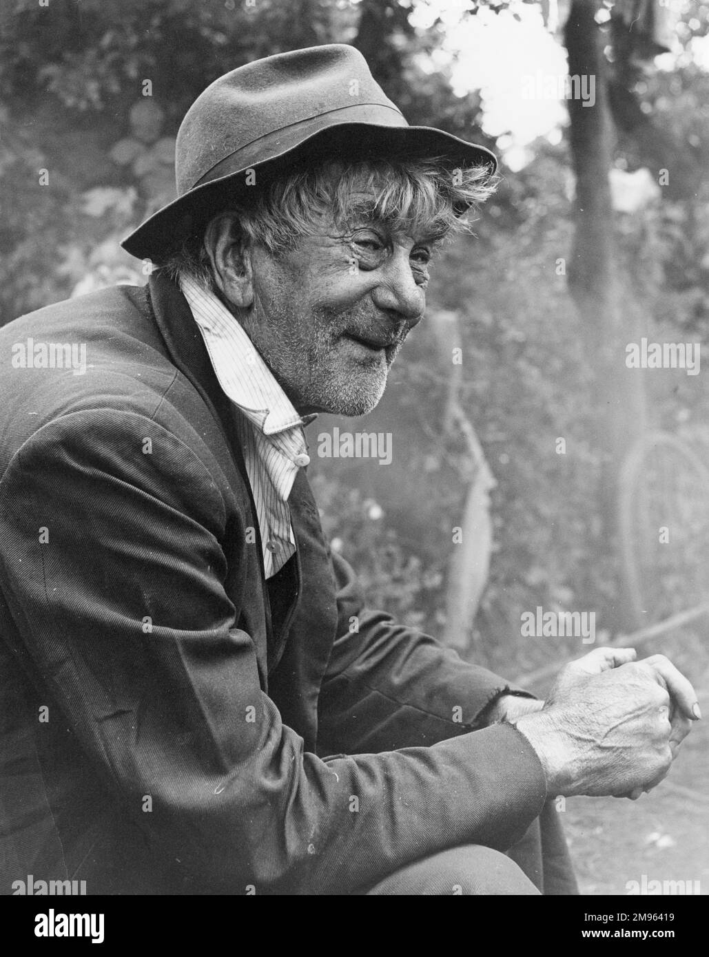 An old gipsy man, who looks quite a character, relaxing at a gipsy camp ... An old gipsy man, who looks quite a character, relaxing at a gipsy camp ...
