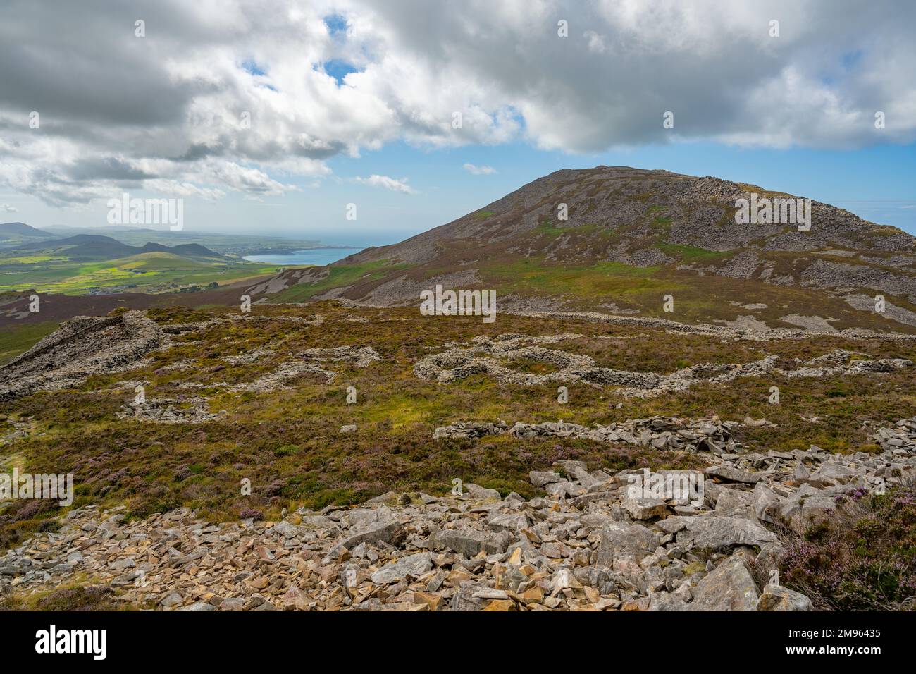 Round stone huts the Iron Age hill fort of Tre'r Ceiri on the Llyn ...
