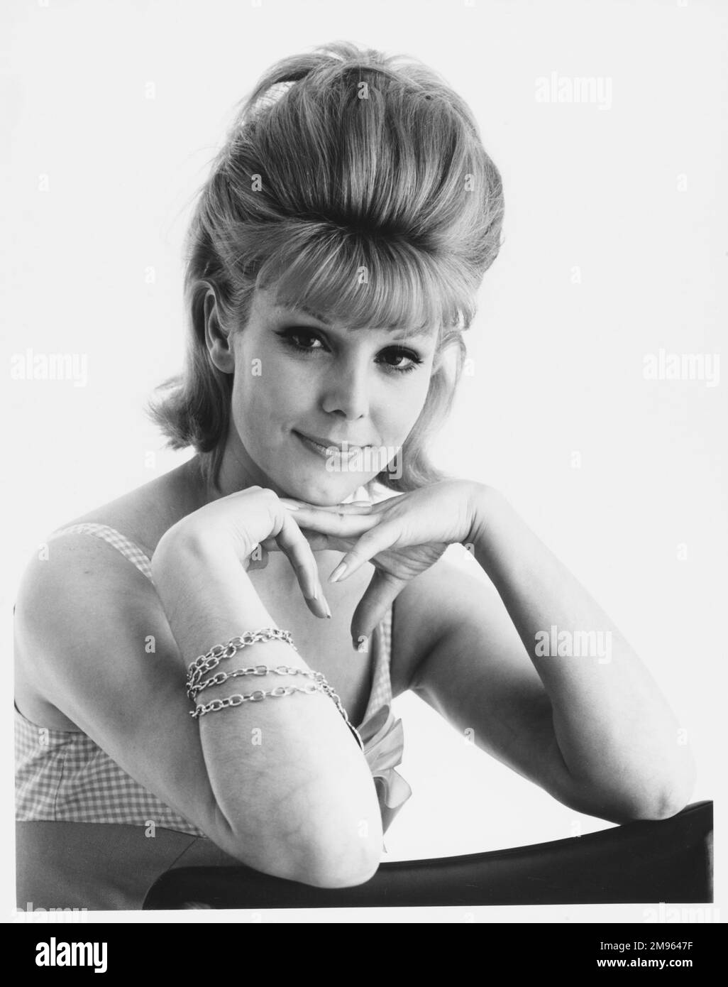 Head and shoulders portrait of blonde model leaning backwards on a ...