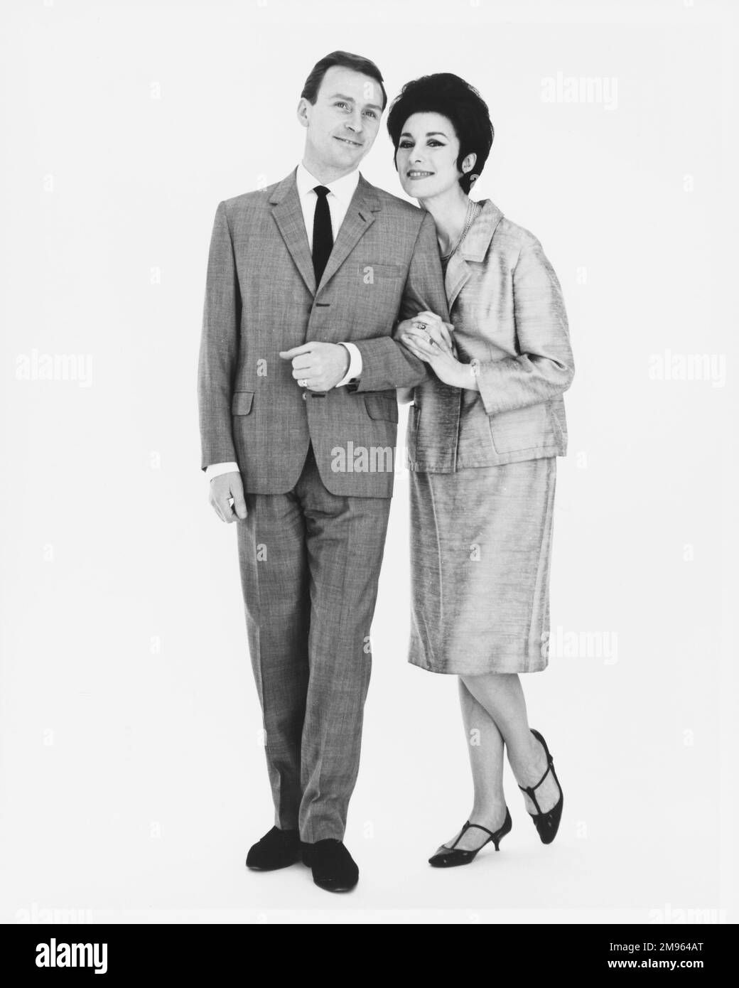 Full-length portrait of a suited couple Stock Photo - Alamy