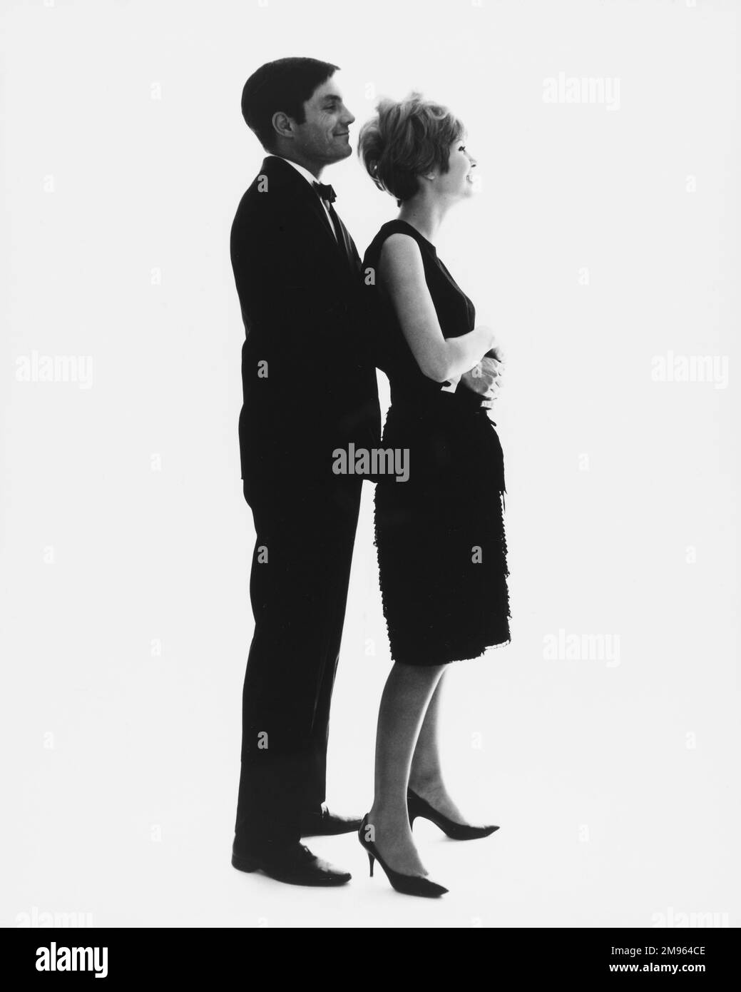 Full-length profile portrait of a couple in formal evening dress Stock ...
