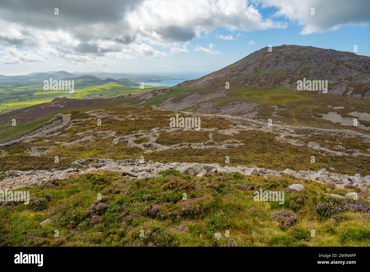 Round stone huts the Iron Age hill fort of Tre'r Ceiri on the Llyn ...