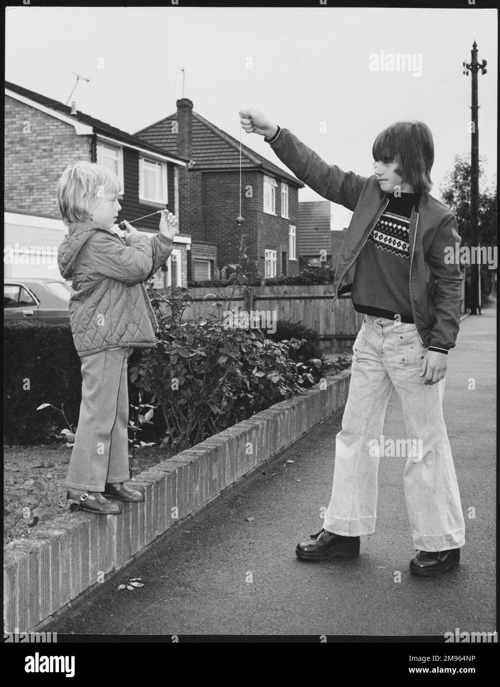Two boys playing Black and White Stock Photos & Images - Alamy