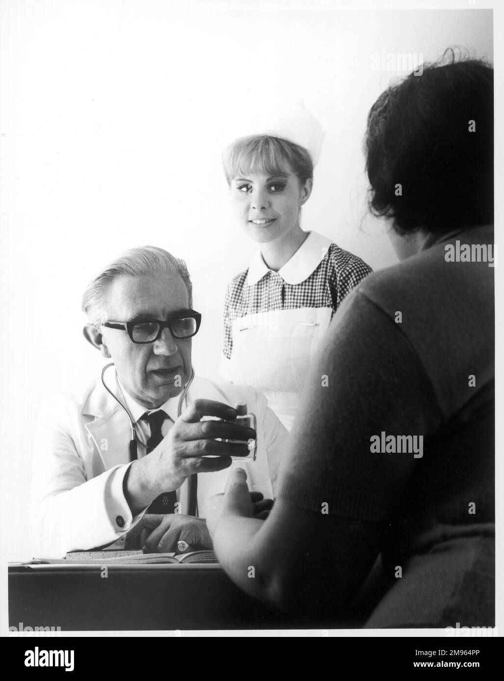 Nurse and patient and desk Black and White Stock Photos & Images - Alamy