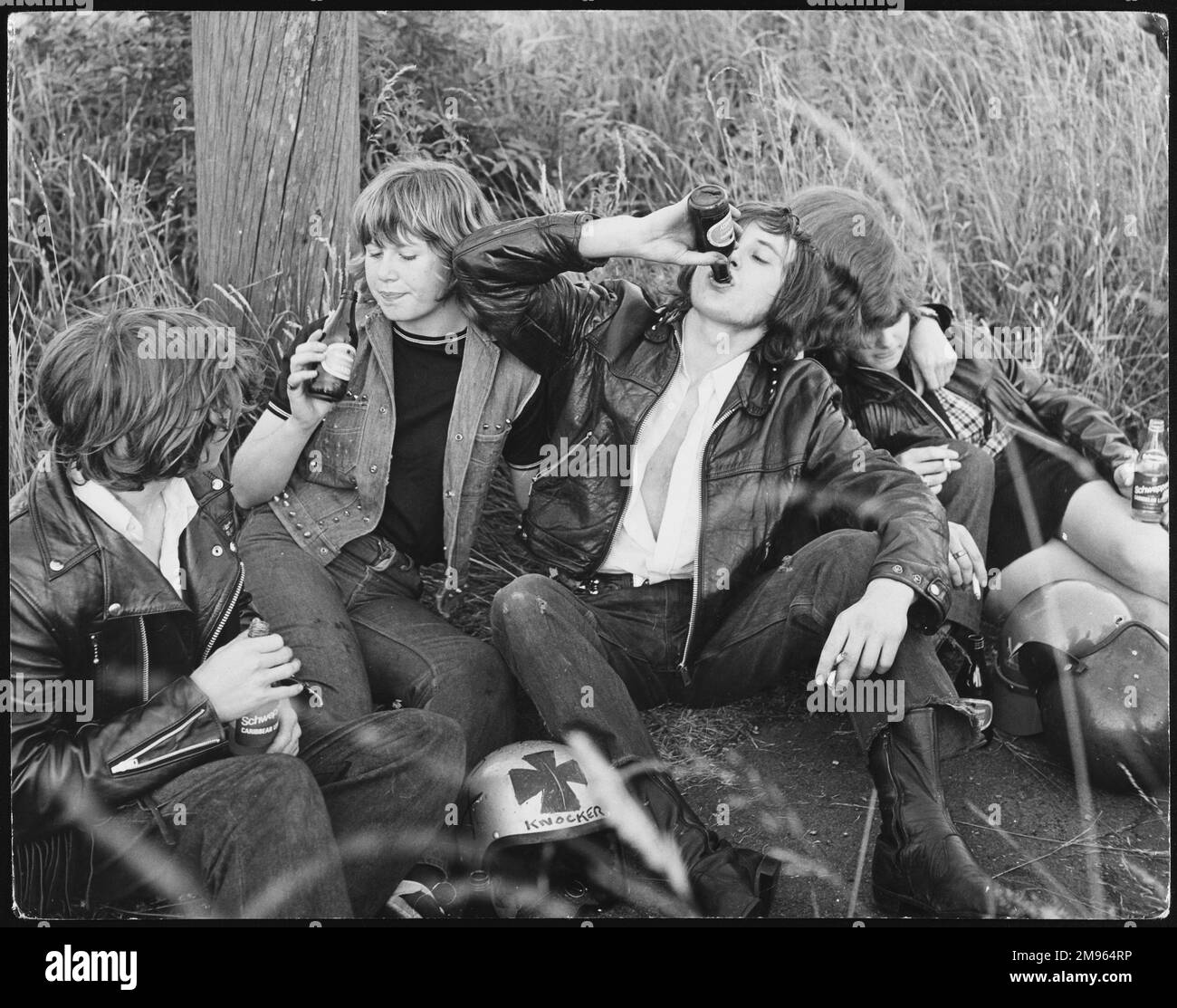 A rebellious group of English teenagers wearing leathers and denim ...