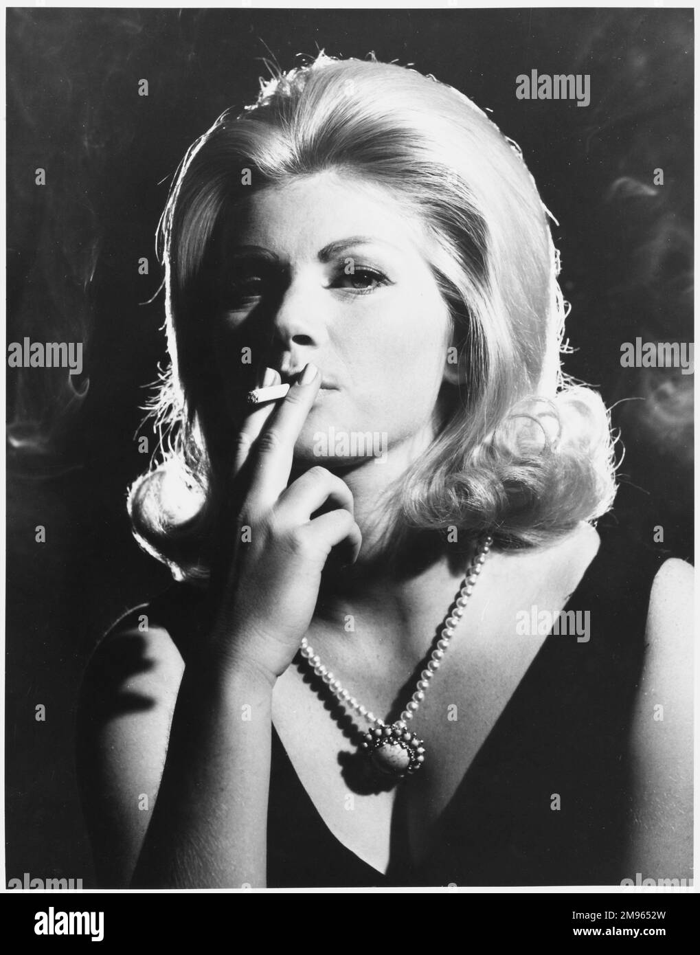 Woman smoking 1960s hi-res stock photography and images - Alamy