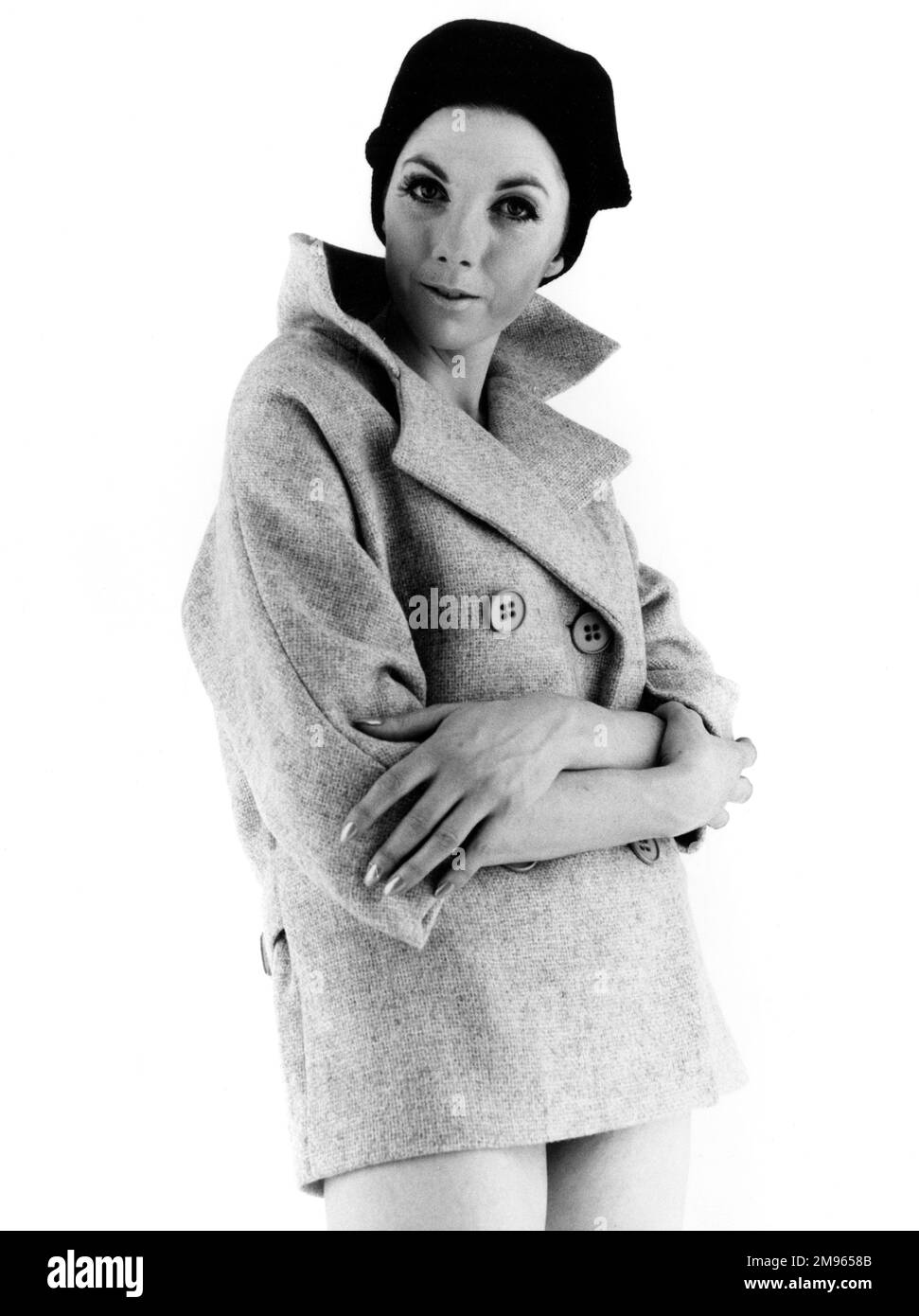 A woman poses in only a jacket Stock Photo - Alamy