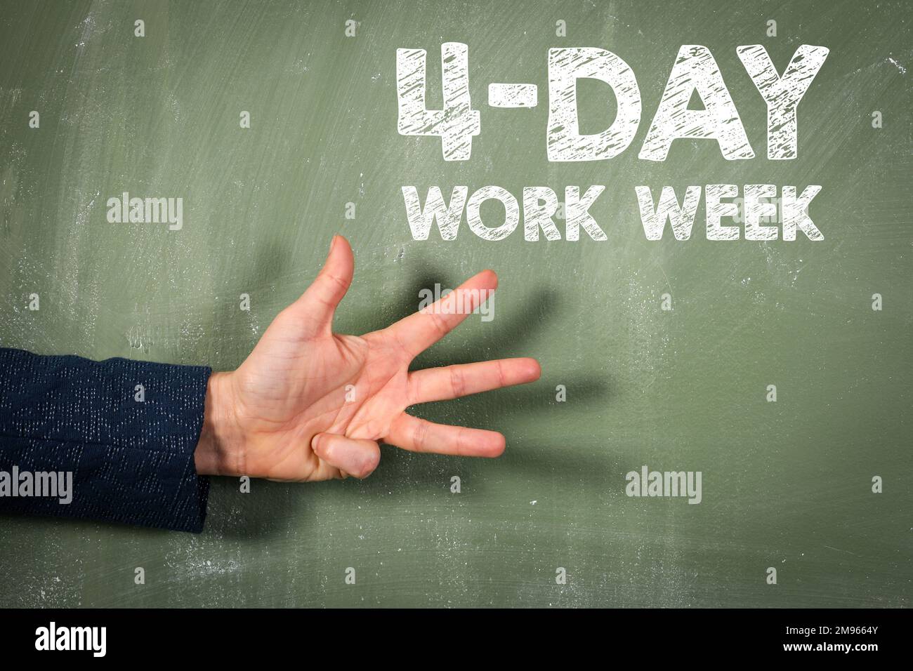 4-day work week. Green chalkboard background and female hand Stock ...