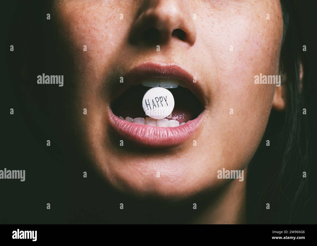 Itll be okay, said my happy pill. an unrecognisable woman taking a pill ...