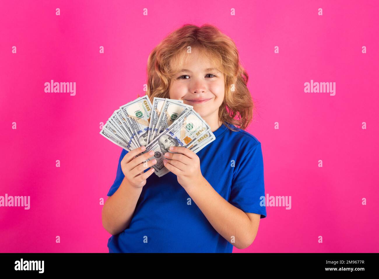 Money win, big luck. Kid having a lot of hundred dollars isolated on ...