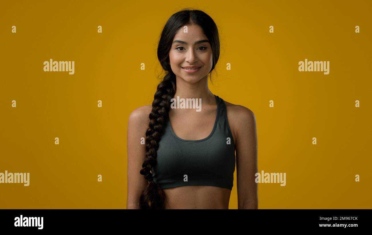 Ethnic happy smiling 20s woman Indian sport lady multiracial strong slender girl sports trainer ...