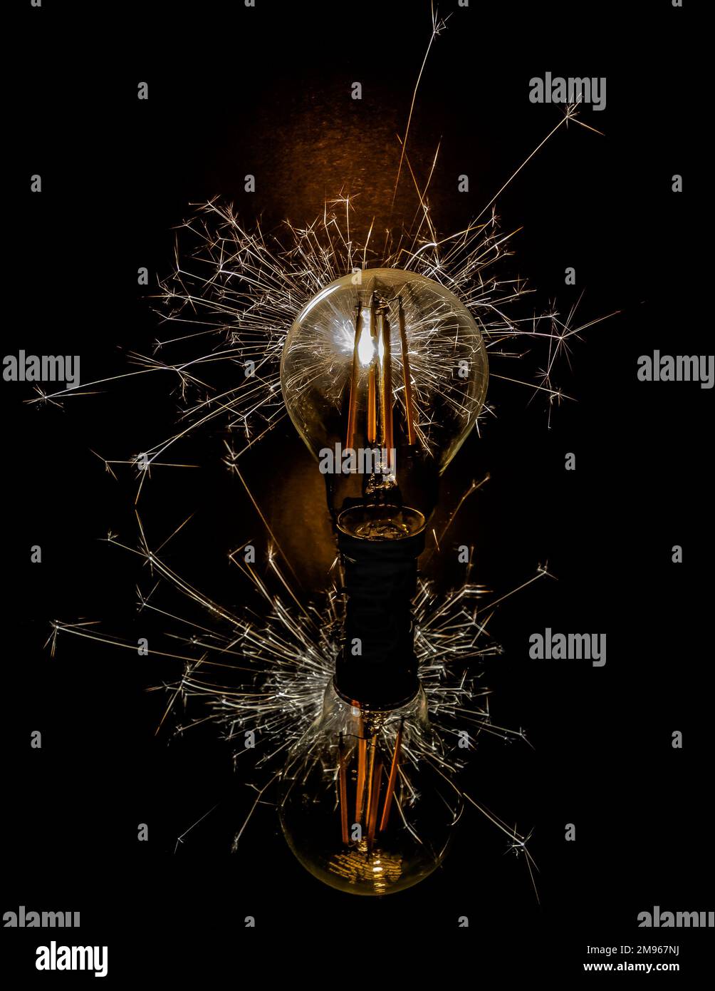 Light bulb with sparks Stock Photo - Alamy
