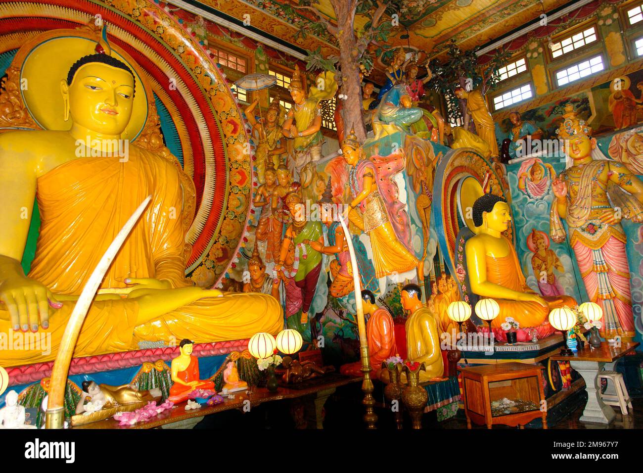 Seated Buddhas in a multi-religious temple in Colombo, Sri Lanka Stock ...