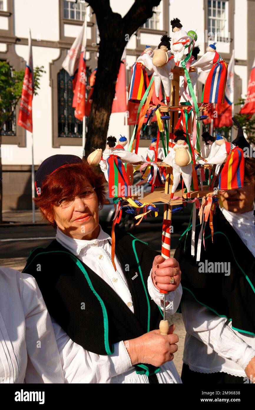 A woman from a folklore group from the village of Camacha, seen here in ...