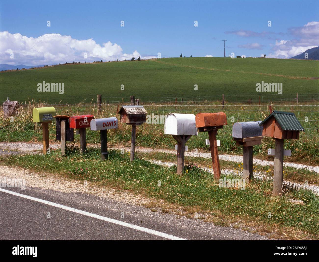 A row of colourful farm mail boxes at the roadside in Takaka, at the ...