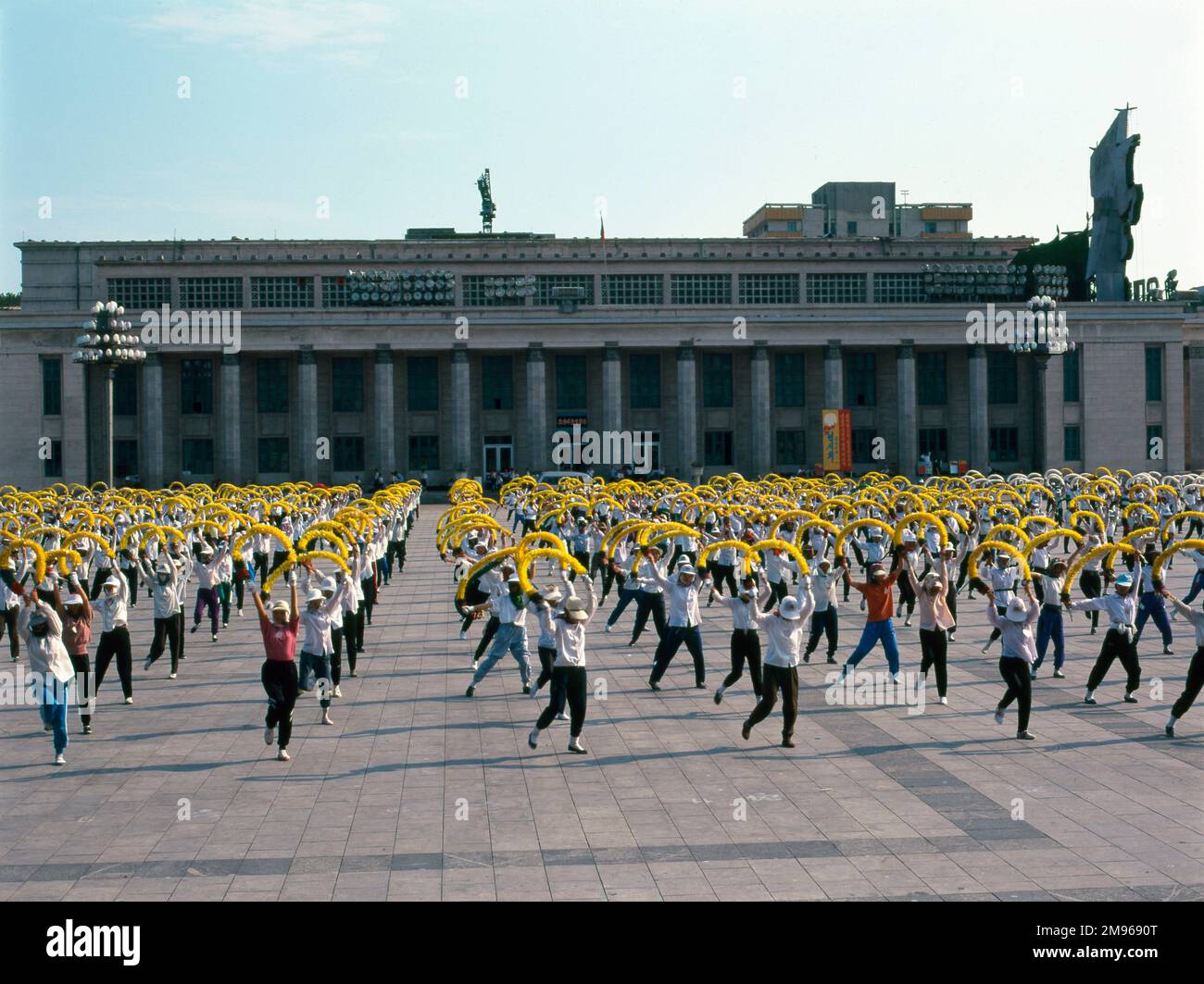 Young people in formation in Kim Il Sung Square, in front of the Korean ...