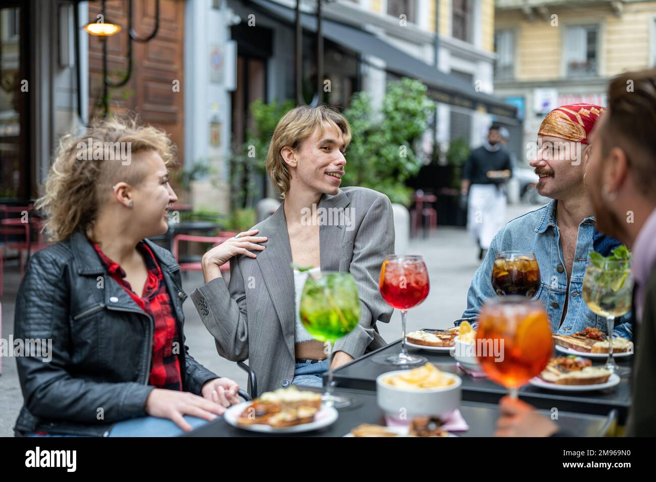 Group of diverse people toasting with beverage, happy friends ...