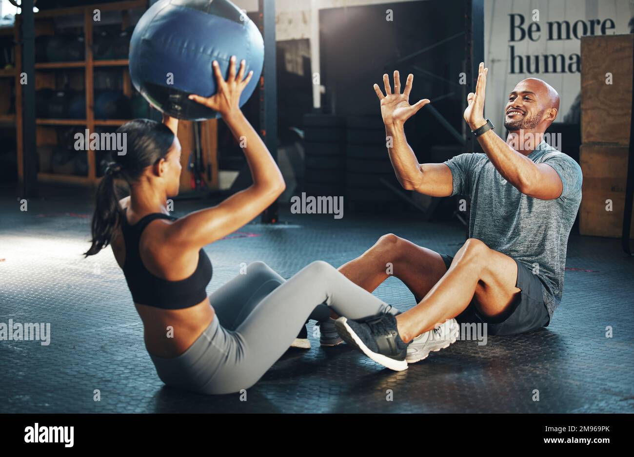 Its a fun workout to enjoy together. a sporty young man and woman ...