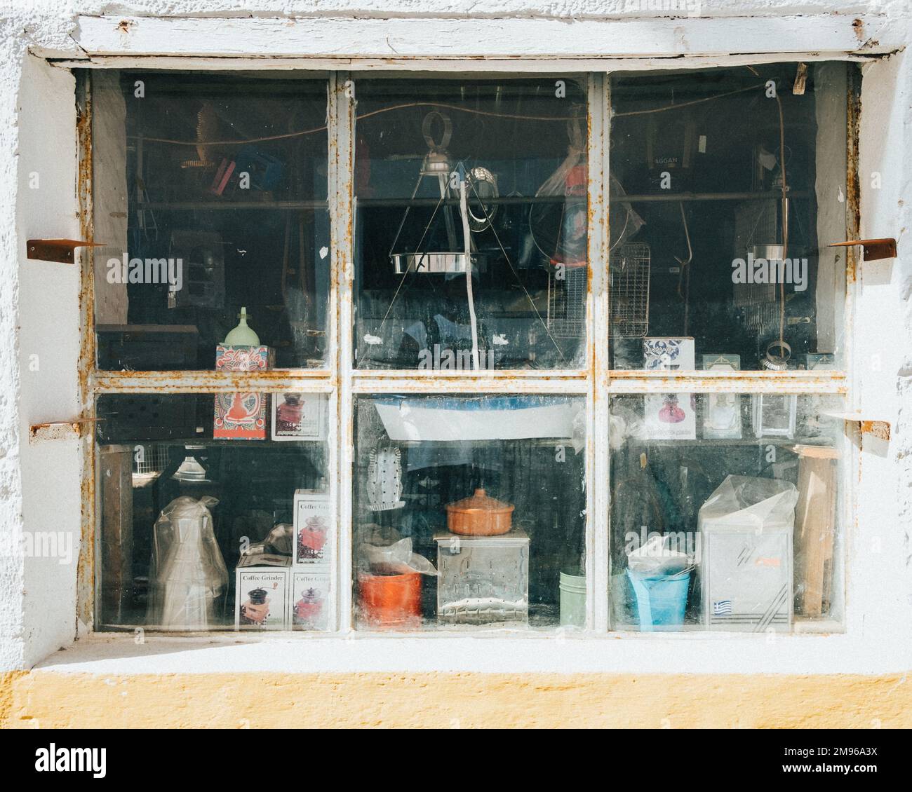 A shot of old household items behind dirty windows Stock Photo - Alamy