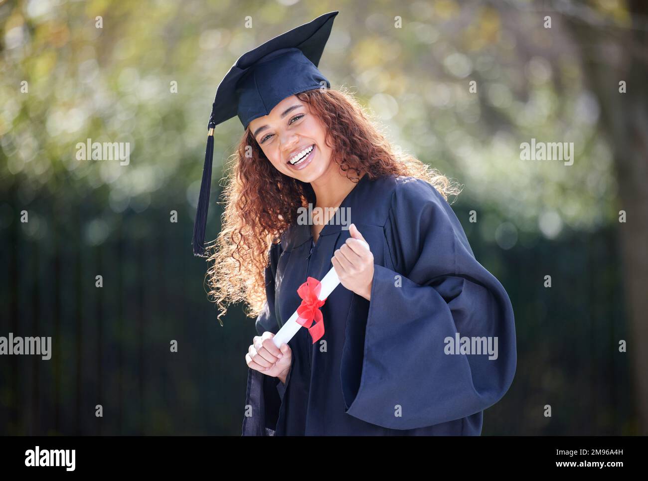 The greatest reward is the journey. Portrait of a young woman holding ...