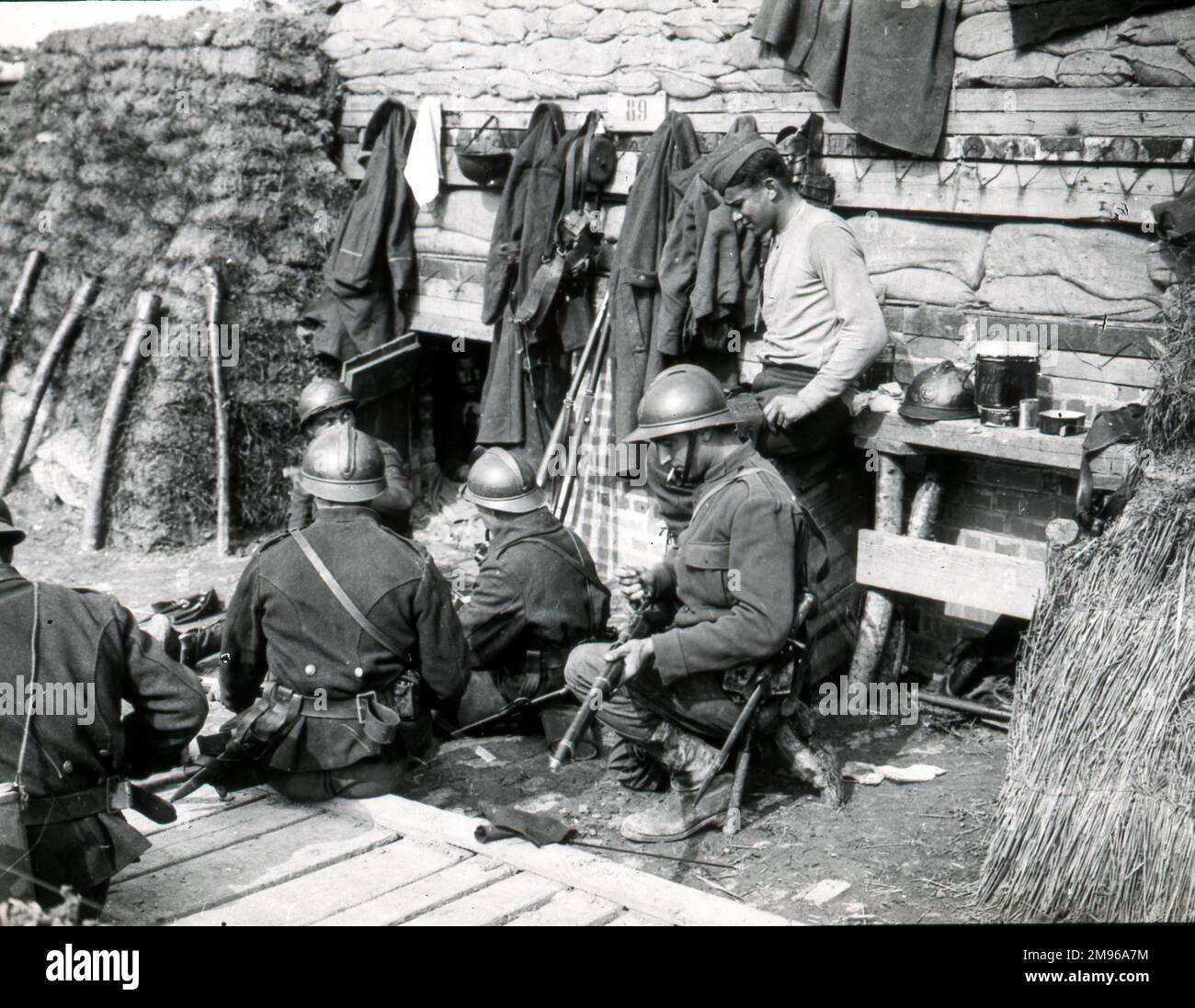 A group of soldiers during the First World War cleaning their weapons ...