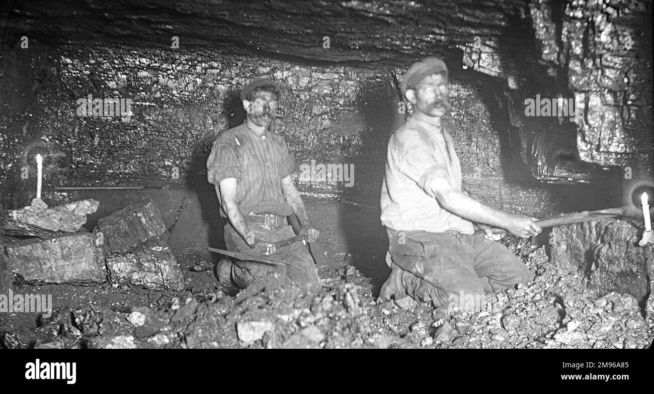 Two men kneeling in a narrow seam, undercutting the coal in Baldwin's ...