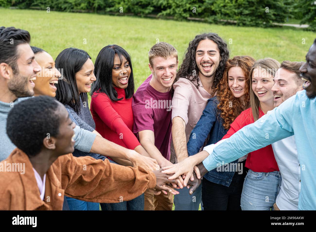 Multiracial people joining hands together, happy friends, peace and ...