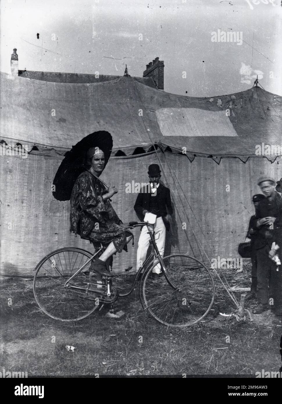 An 'oriental lady' cyclist (probably a man in drag), one of the ...