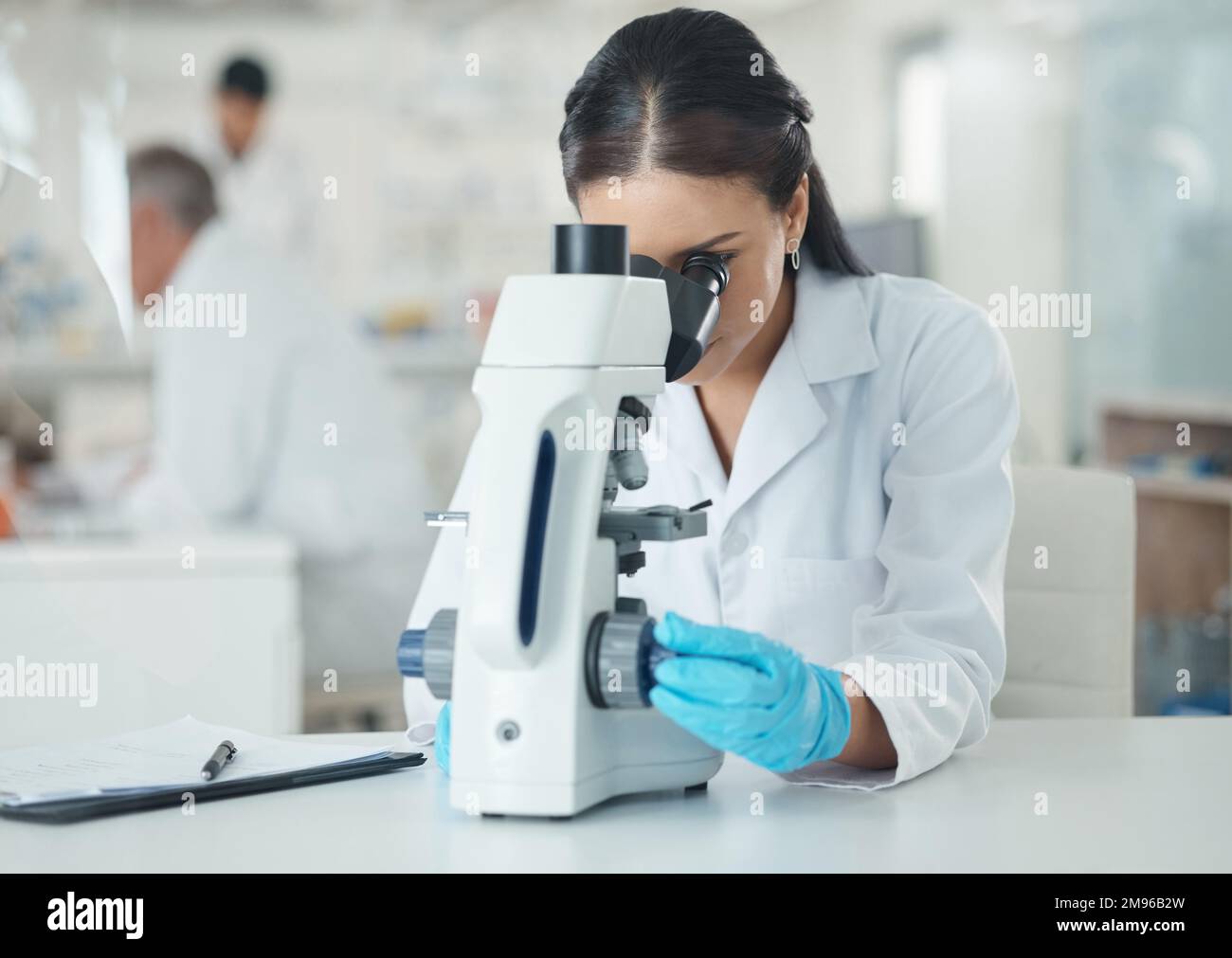 Female scientist analyse microscope hi-res stock photography and images ...