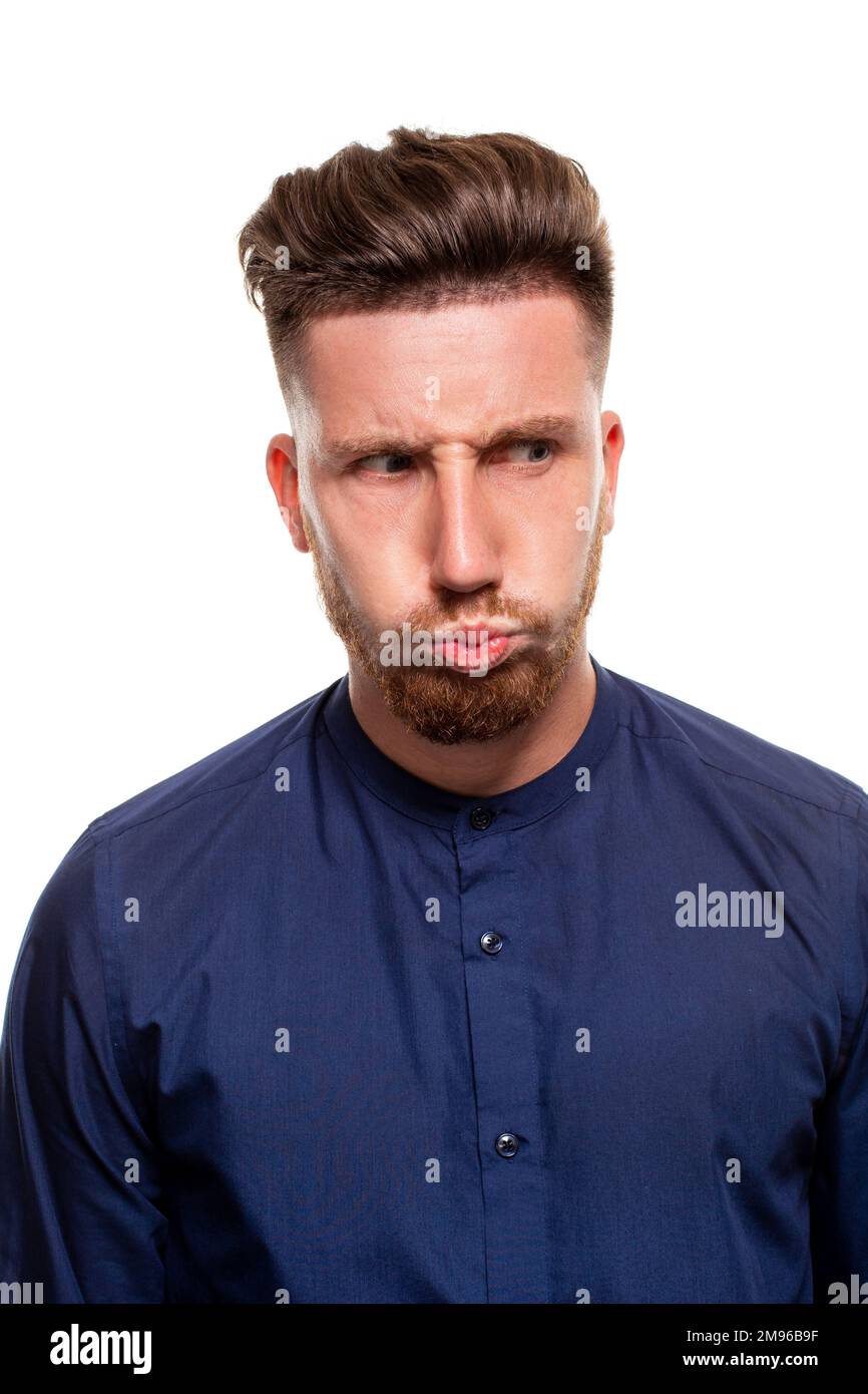 Attractive young man wearing blue shirt, isolated over a white ...