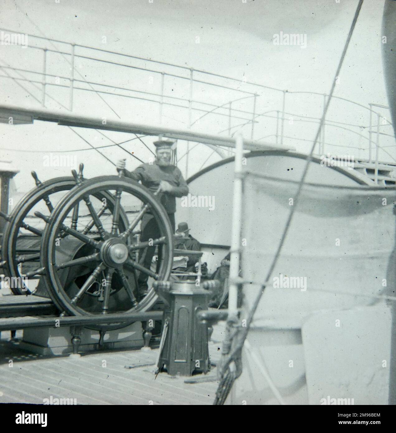 A seaman at the wheel of a ship, smiling straight at the camera Stock ...