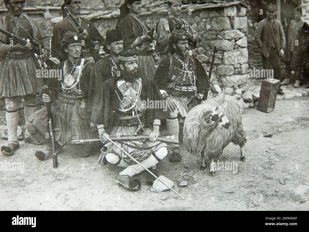A group of Albanian soldiers in traditional costume, with rifles. Their ...