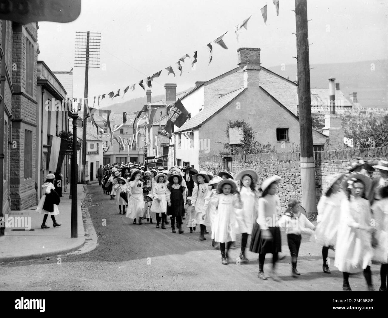 A long line of local schoolgirls parade along Beaufort Street in ...
