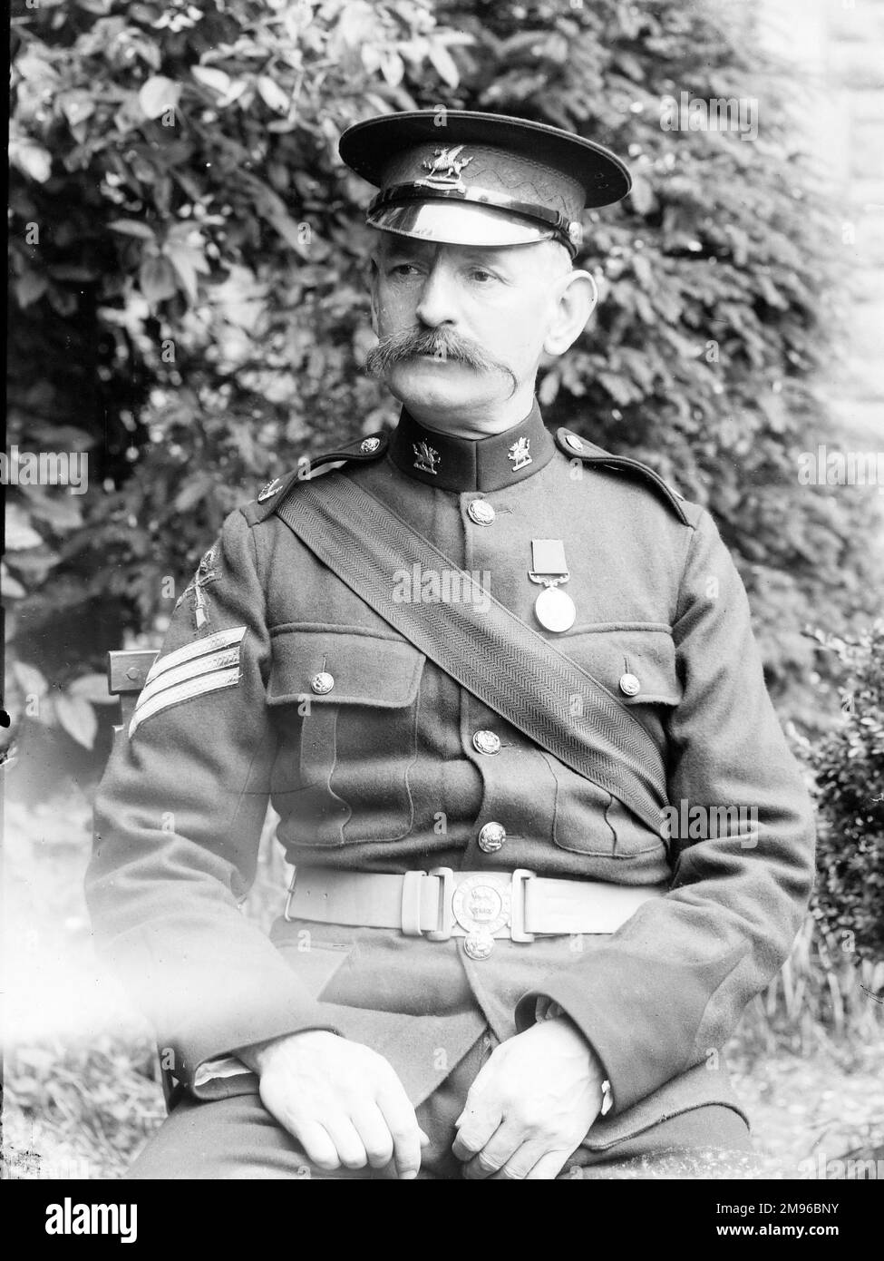 Portrait of a retired army sergeant in full uniform, posing for his ...