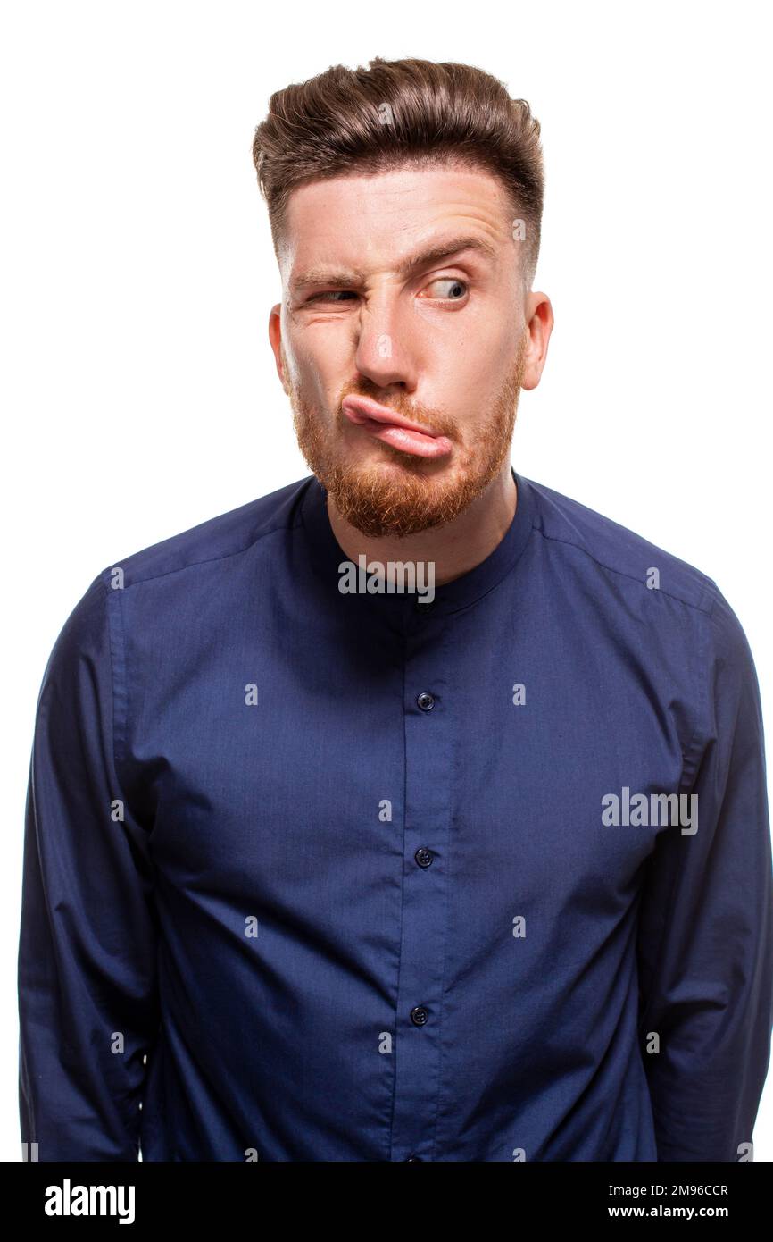 Attractive young man wearing blue shirt, isolated over a white ...