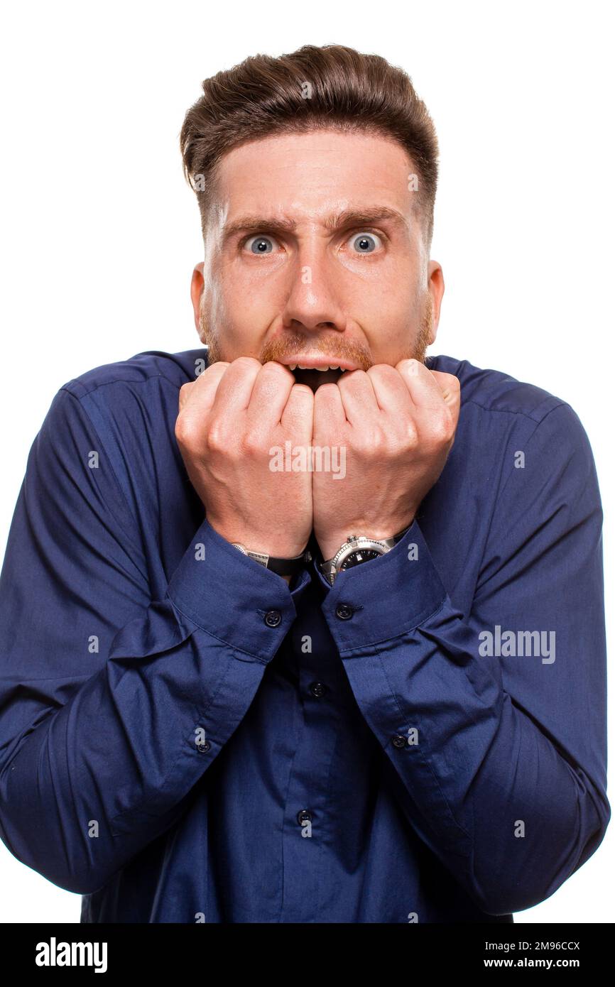 Attractive young man wearing blue shirt, isolated over a white ...
