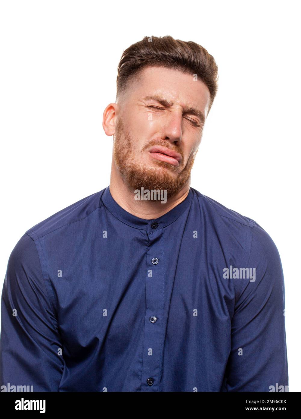 Attractive young man wearing blue shirt, isolated over a white ...