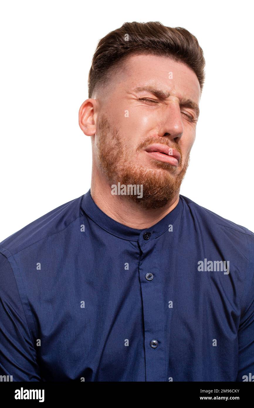 Attractive young man wearing blue shirt, isolated over a white ...