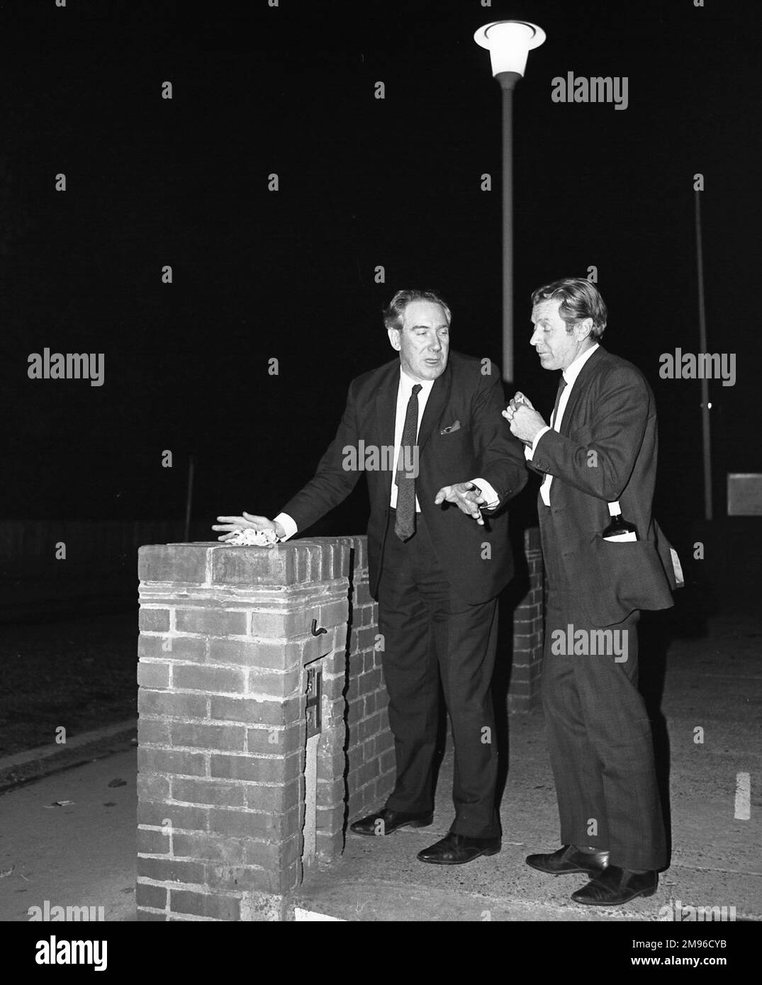 Two men one dressed Black and White Stock Photos & Images - Alamy