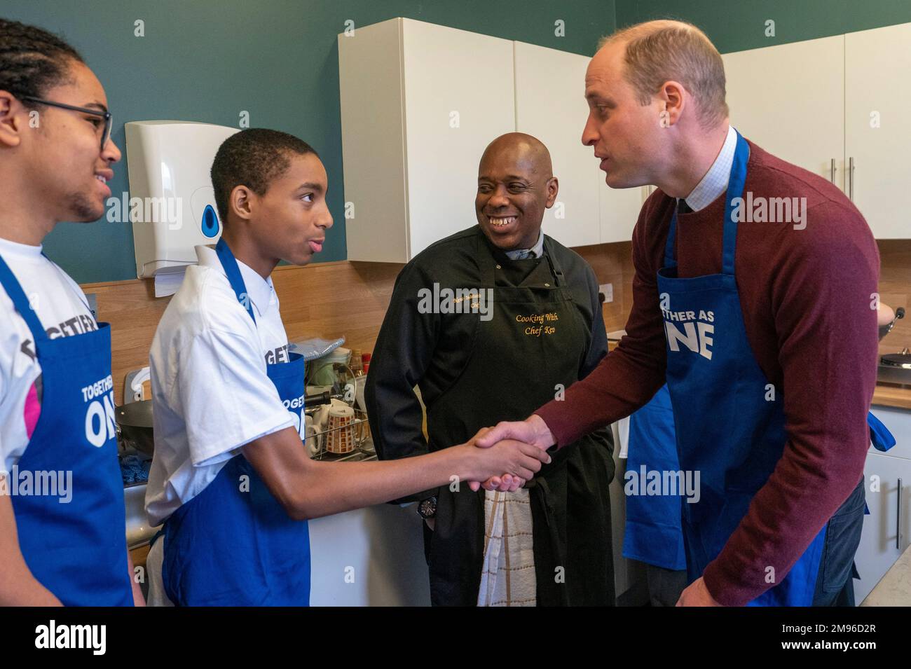 The Prince of Wales shakes hands with Ramae Bogle 13, during his visit ...