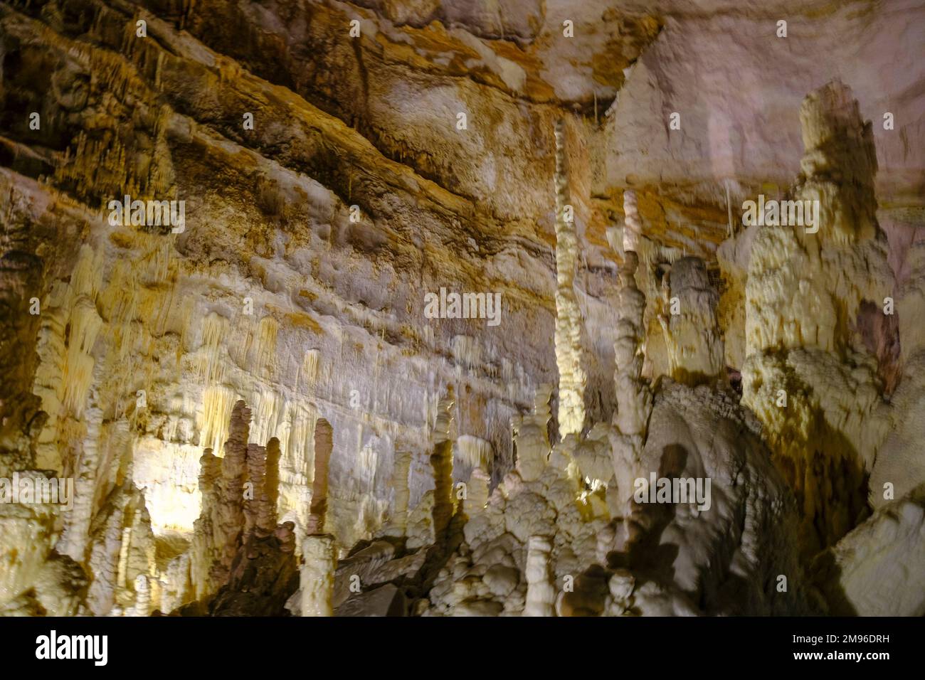 White ancient stalagmites closeup in the cages of Grotta di Frasassi ...