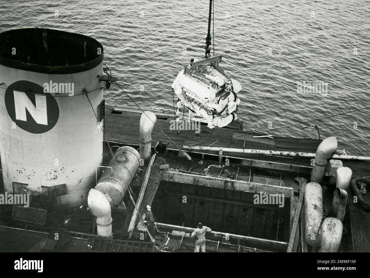 Deltic Marine Compound engine being lowered into a ship Stock Photo - Alamy