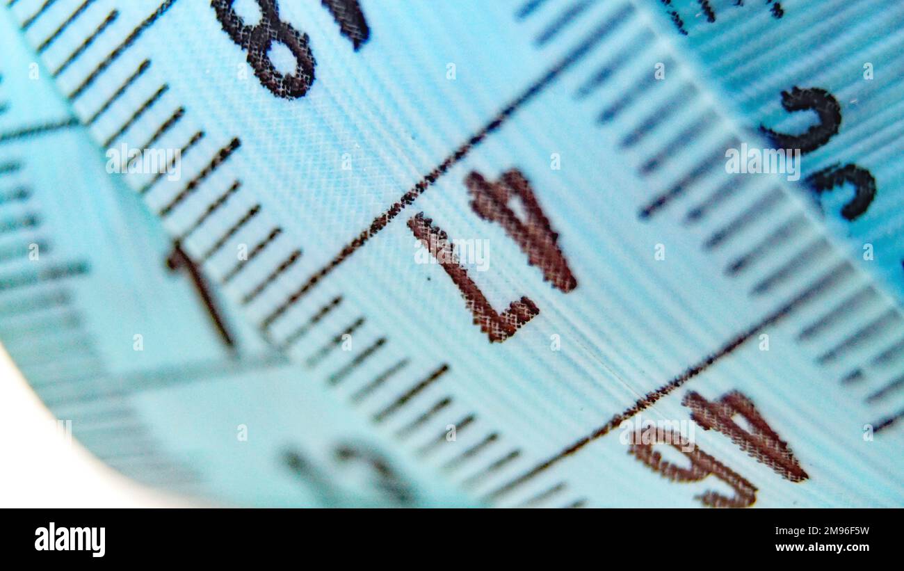 Sewing blue meter on white background Stock Photo - Alamy