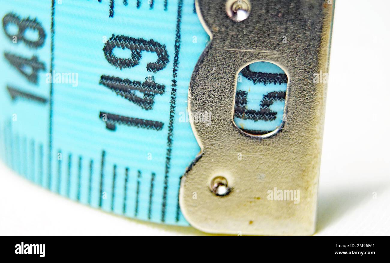 Sewing blue meter on white background Stock Photo - Alamy