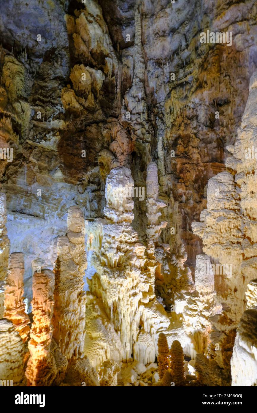 White ancient stalagmites closeup in the cages of Grotta di Frasassi ...