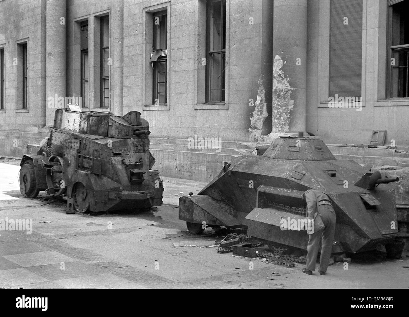Two disabled tanks at the side of a building in Germany during the ...