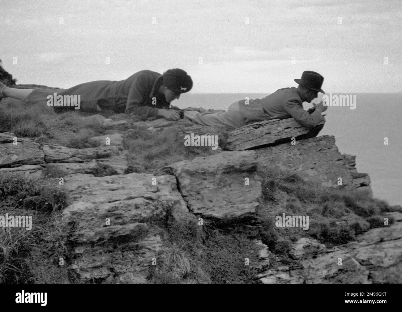 Woman lying on a rock Black and White Stock Photos & Images - Alamy