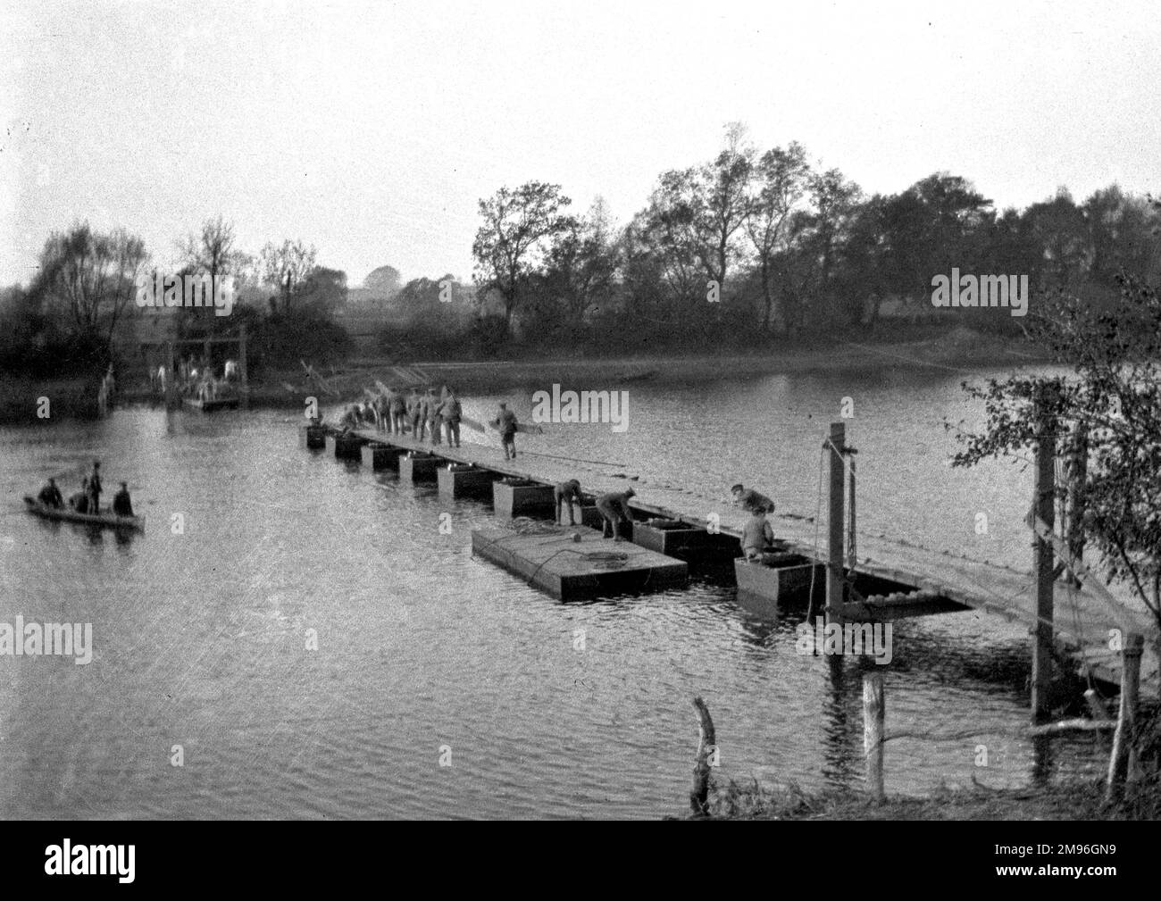 Soldiers constructing a Bailey Bridge across a river Stock Photo - Alamy
