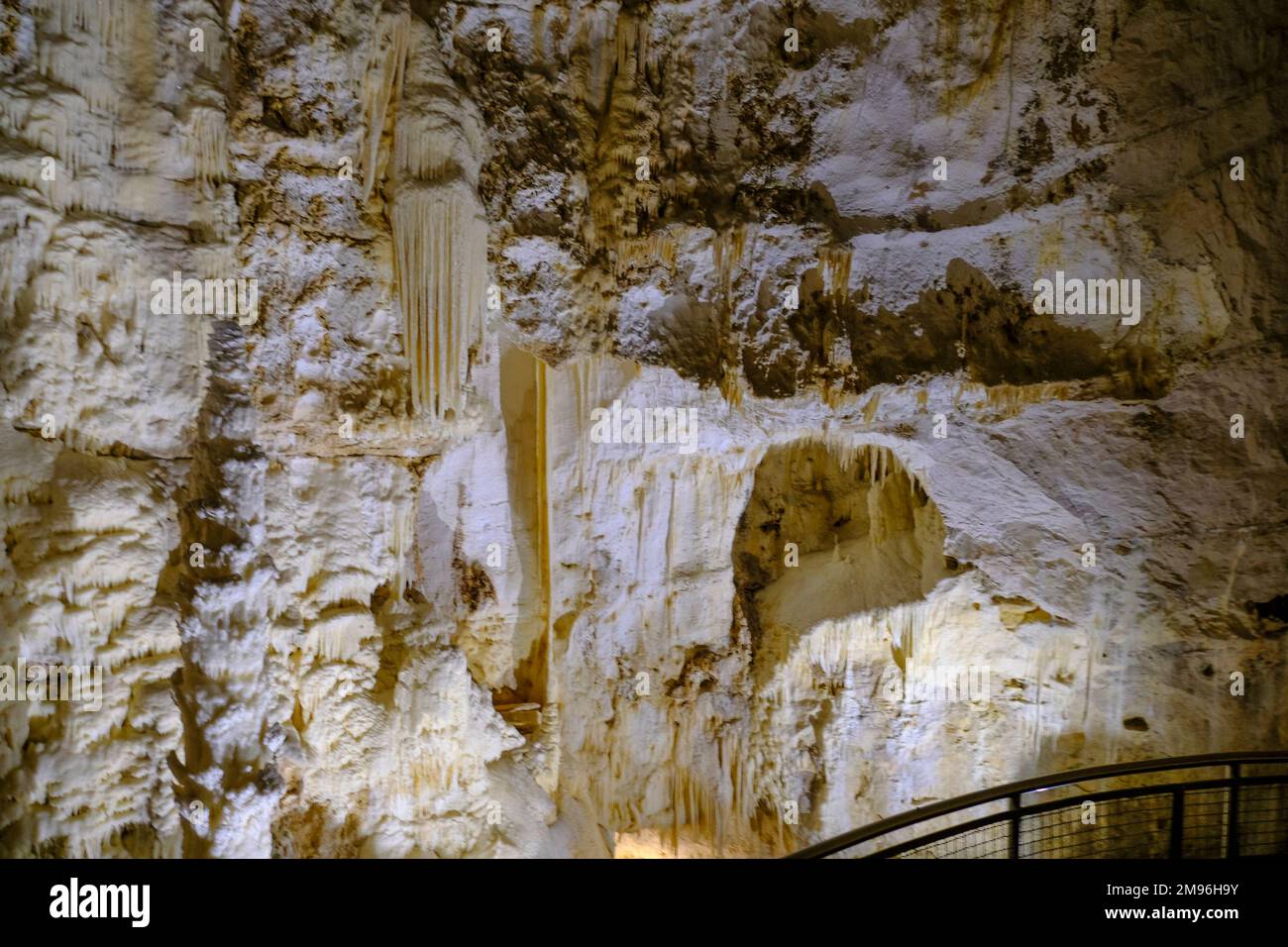 White ancient stalagmites closeup in the cages of Grotta di Frasassi ...